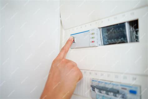 Premium Photo Close Up Of Hand Turning Onoff The Fuse Fuse Box At