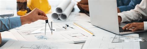 Premium Photo Architect Or Engineer Working On Building Blueprint
