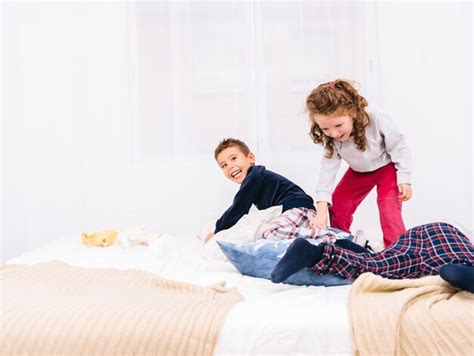 Premium Photo Cheerful Siblings Enjoying At Home