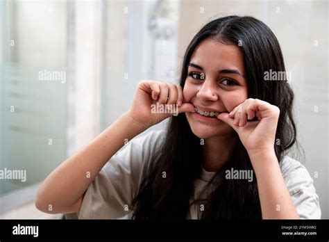 Brunette Teen Fingering Her Braces Stock Photo Alamy