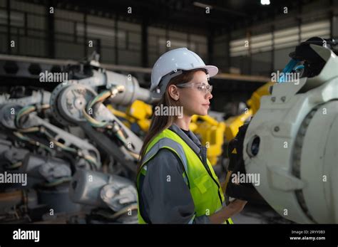 In The Robots Warehouse Female Engineer Happily With Updating Software