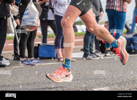 Male Runners Competing In The Great North Run Half Marathon Wearing
