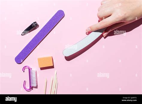 Woman Aligns Her Nails With A Nail File Alignment Of The Nail Edge