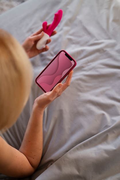 Free Photo Front View Woman With Smartphone And Vibrator