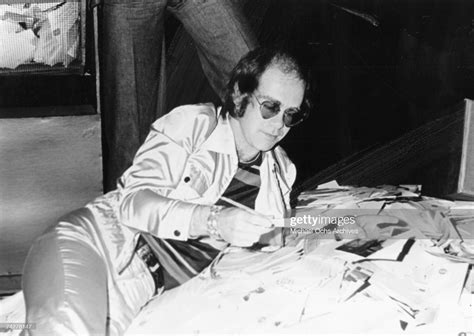 Pop Singer Elton John Sifts Through A Mountainous Pile Of Fan Mail