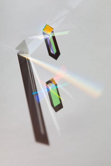 Premium Photo Glass Geometric Figures Prisms With Light Diffraction Of Spectrum Colors And