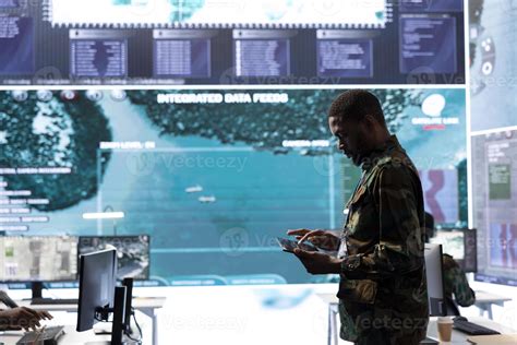 Military Personnel In A Base Of Operations Using Advanced Computers And