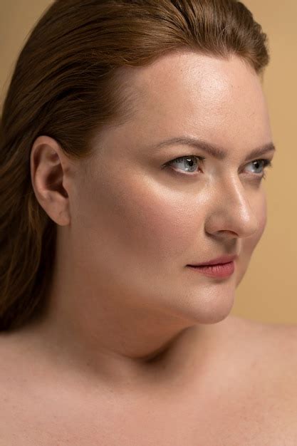 Premium Photo Side View Plus Size Model Posing In Studio