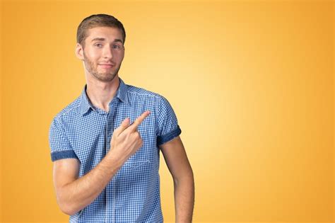 Premium Photo Young Man In Glasses Pointing Up