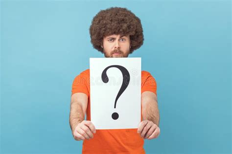 man holding question mark finding smart solution asking for advice