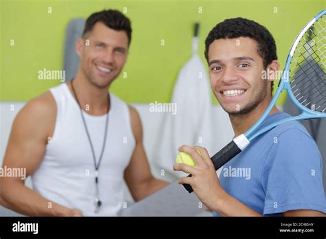 A Tennis Player With Coach Stock Photo Alamy