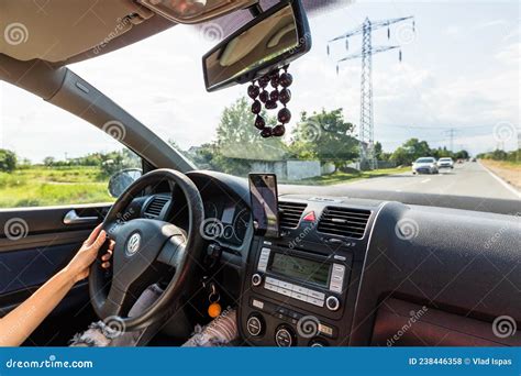 In Car Dashboard View With Smartphone On Waze Maps Driver Using Waze