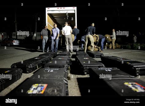 Marines With 1st Marine Regiment Stage Rifle Cases As They Load Their