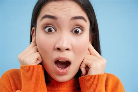 Premium Photo Close Up Portrait Of Asian Girl Shuts Her Ears From