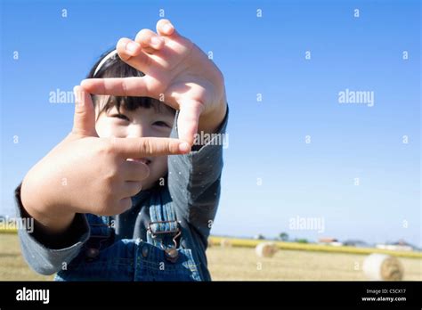 Girl Making Rectangular Shape Using Her Fingers Stock Photo Alamy