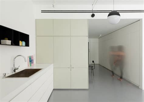 Thin Black Frames Draw The Eye Around A Renovated Tel Aviv Apartment