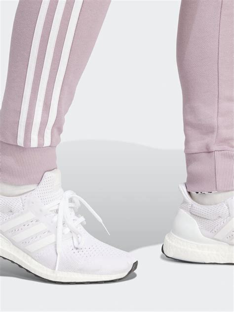 adidas Spodnie dresowe Essentials 3-Stripes IR5379 Różowy Slim Fit ...