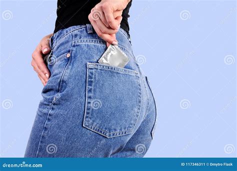 Woman Is Putting A Condom In Back Jeans Pocket Stock Image Image Of