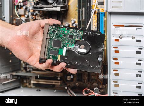 Closeup Image Of Technician Man Hand Changing The Hard Drive Of Pc Computer Maintenance And