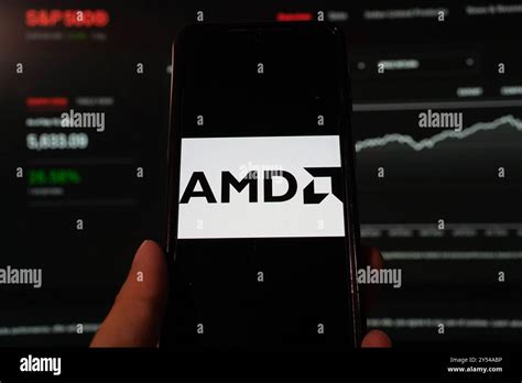 In This Photo Illustration Advanced Micro Devices Logo AMD Is Displayed On A Smartphone With