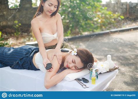 Two Asia Women Doing Spa Massage Together In Outdoor Stock Image