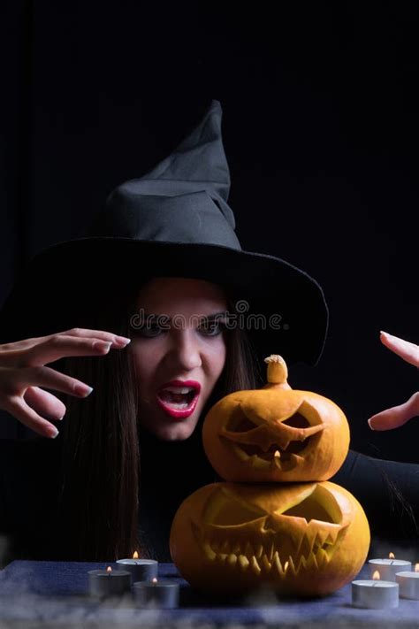 Halloween Witch With A Magic Pumpkin Beautiful Young Woman In Witches