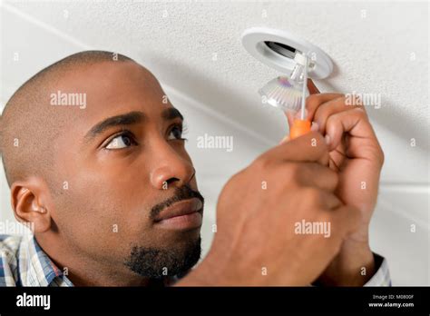 Replacing A Light Bulb Hi Res Stock Photography And Images Alamy