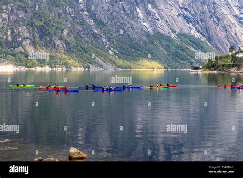 Eidfjord Norway Tour Group In Kayaks Paddle On The Fjord Eidfjord Is An Inner Branch Of