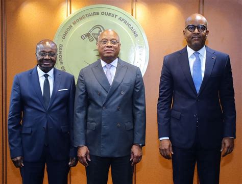 Jean Claude Kassi Brou Le Gouverneur De La Bceao Reçoit Le Pca Du Dc Br Faman Touré Et Le Dg Du