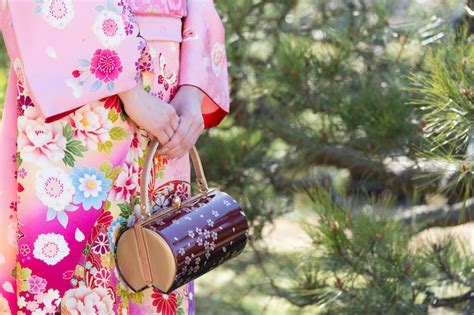 Premium Photo Midsection Of Woman Wearing Pink Dress Holding Purse