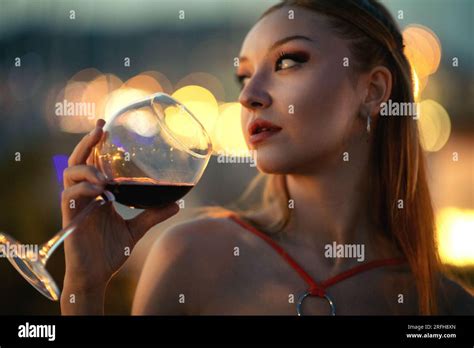 A Close Up Portrait Of A Young Woman In Her Early Twenties Wearing An
