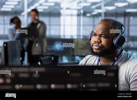 Admin In Server Hub Listening Music And Ensuring Compliance With Industry Standards And