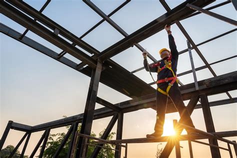 Premium Photo A Construction Worker Working At Height Equipment Using