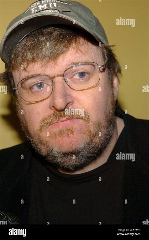 Director Michael Moore Poses During The Cocktail Of The Bush