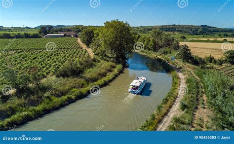 Aerial Top View Of Boat In Canal Du Midi From Above Travel By Barge In