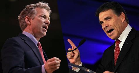 Rand Paul Rick Perry Holding A Reagan Off