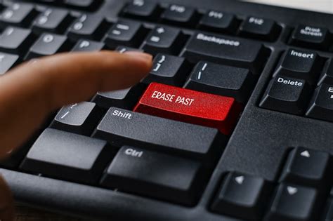 Premium Photo Selective Focus Of A Finger And A Red Button Computer