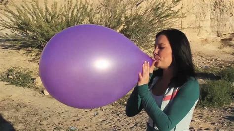 Christine Blows Up A Purple Balloon Until It Pops