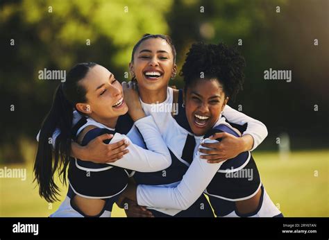 Teamwork Hug Or Portrait Of Cheerleader With People Outdoor In