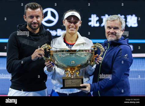 Caroline Wozniacki Of Denmark Center Poses With Her Champion Trophy