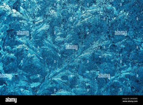 Christmas Background With Frozen Pattern On Window Glass Real Blue