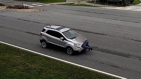 Watch Florida Hit And Run Suspect Flees With Victim Clinging To Hood