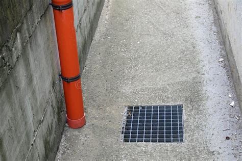 Plastic Gutter For Collecting Rainwater And The Metal Manhole Cover Of