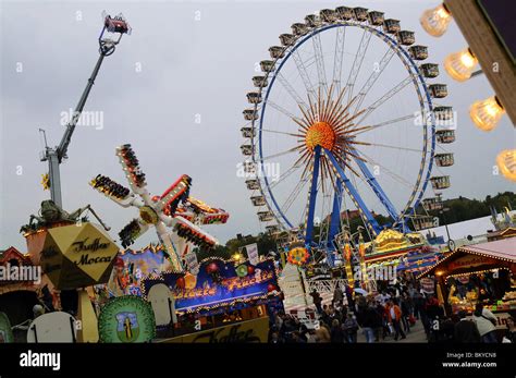 Ferris Wheel And Fun Rides At The Oktoberfest Munich Bavaria Germany