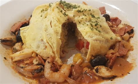 Tornado Omelette With Fried Rice And Seafood Tomato Sauce