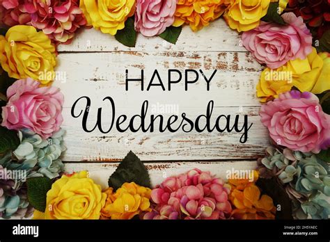 Happy Wednesday Text And Flowers Colorful Border Frame On Wooden