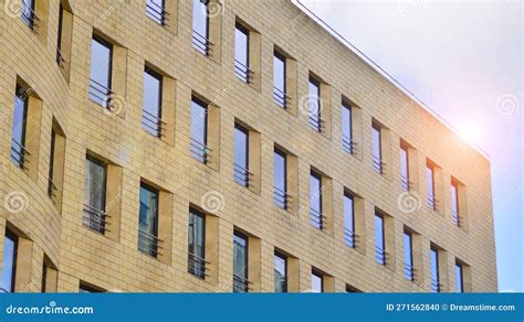 Detail Of A Modern Yellow Brick Building With Large Windows Stock