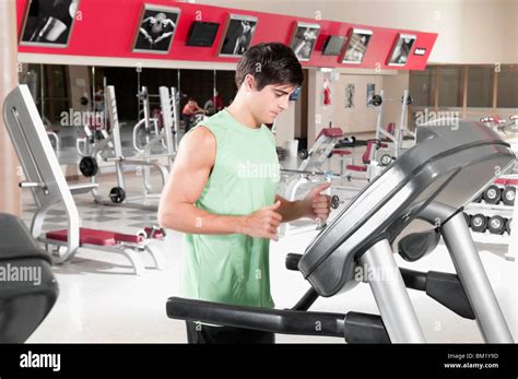 Man Standing On A Treadmill Stock Photo Alamy