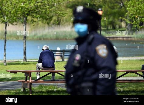 An Nypd School Safety Officer Patrols Baisely Pond Park Enforcing