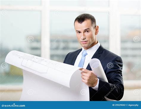 Man Looks At Blueprint In Hands Stock Photo Image Of Confident